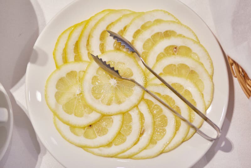 Thin Sliced Lemon Slices on a White Plate Stock Image - Image of color ...