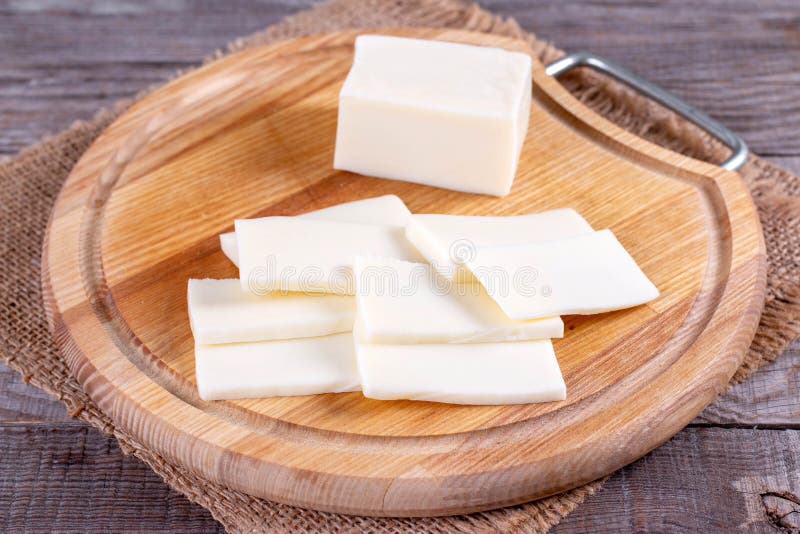Thin Slices of Cheese on a Cutting Board Stock Image - Image of diary ...