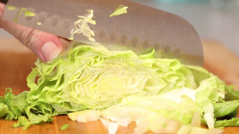Thin Slices of Romaine Lettuce Cut on a Cutting Board in Slo Motion ...