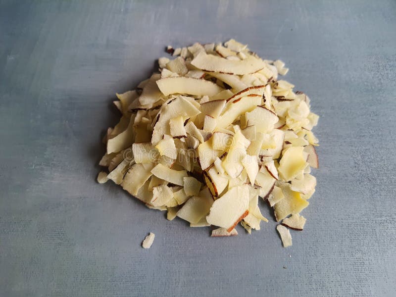 Thin Strips of Coconut, Fresh, Organic, Stacked on a Gray Background ...
