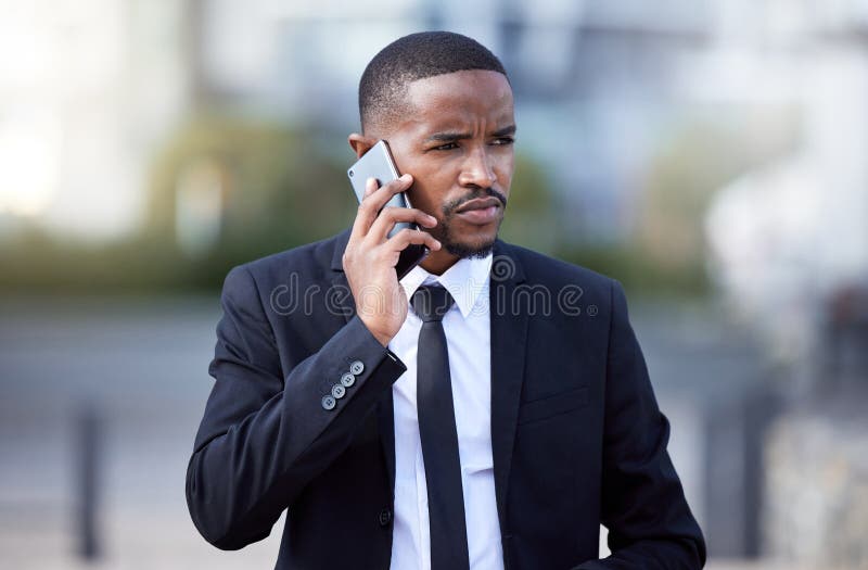 Things are Getting Serious. a Young Businessman Using a Phone in the ...