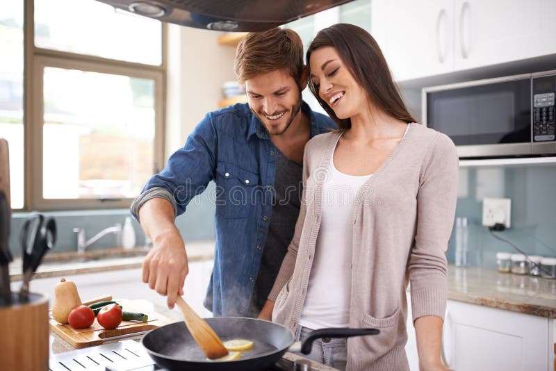 Things are Heating Up in the Kitchen. a Young Couple Making Dinner ...