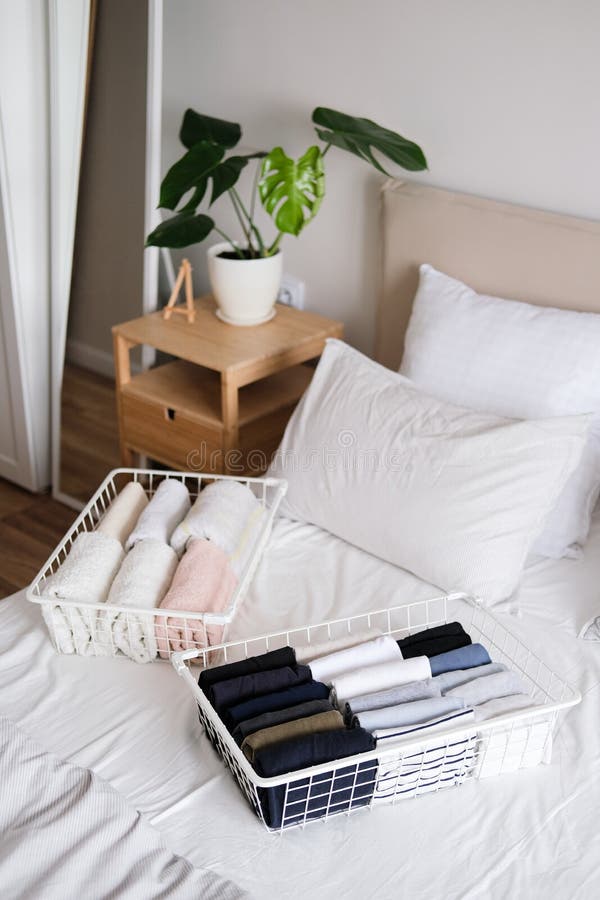 Things in Mesh Storage Containers. Vertical Storage of Clothing Stock ...