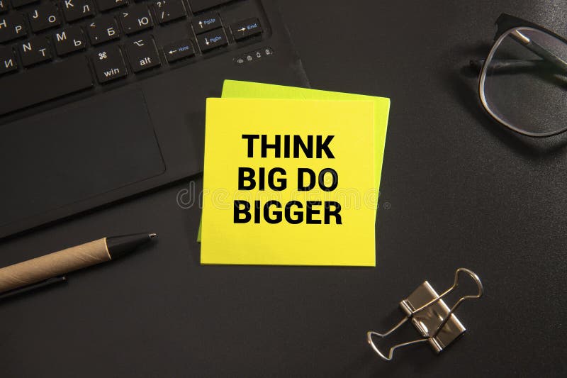 Think Big, Do Bigger Motivation Quote Written on a Note Paper Stock ...