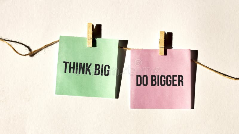 THINK BIG DO BIGGER Text Words Inscription on Yellow Sticker Note on ...