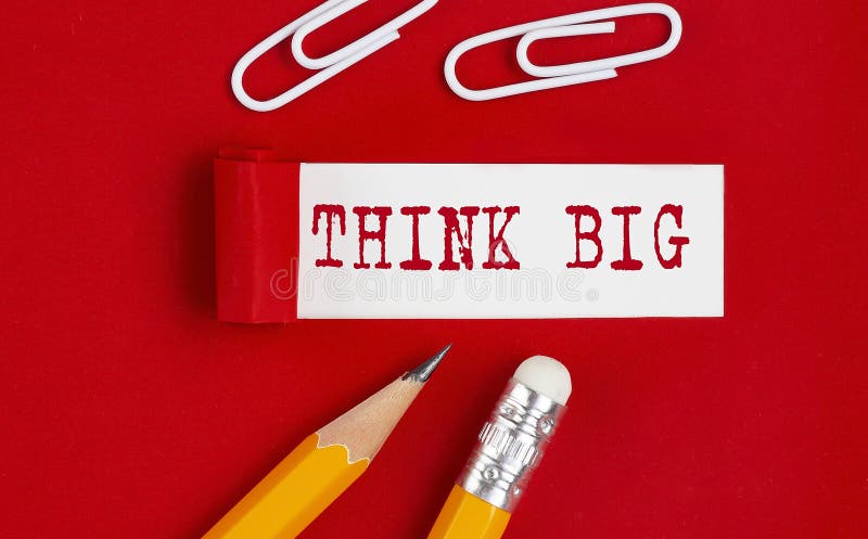 THINK BIG Message Written on Torn Red Paper with Pencils and Clips ...