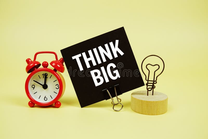 Think Big Text Message on Paper Card with Alarm Clcok on Yellow ...