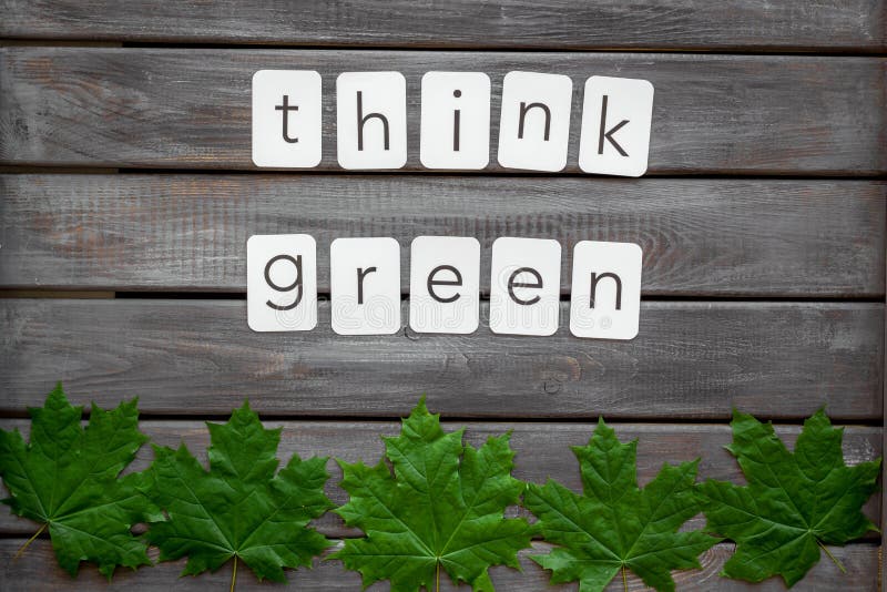 Think Green Concept with Maple Leave on Wooden Background Top View ...