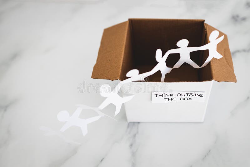 Think Outside the Box Concept with Paper People Chain Getting Out of a ...