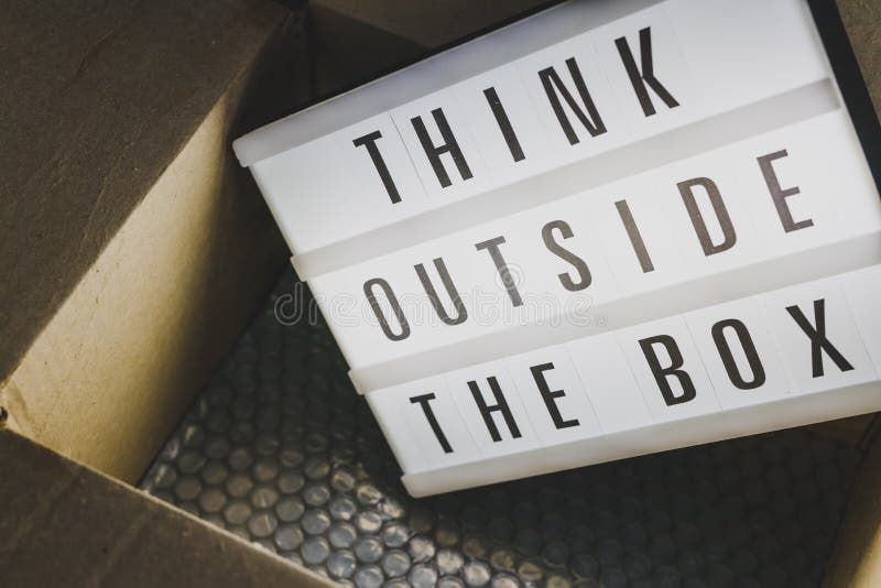 Think Outside the Box Message on Lightbox Coming Out of a Parcel Stock ...