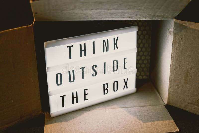 Think Outside the Box Message on Lightbox with Parcel Stock Photo ...