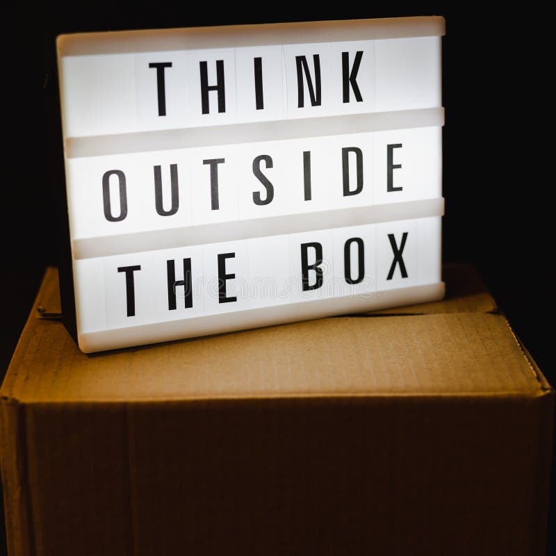 Think Outside the Box Message on Lightbox on Top of Closed Parcel Stock ...