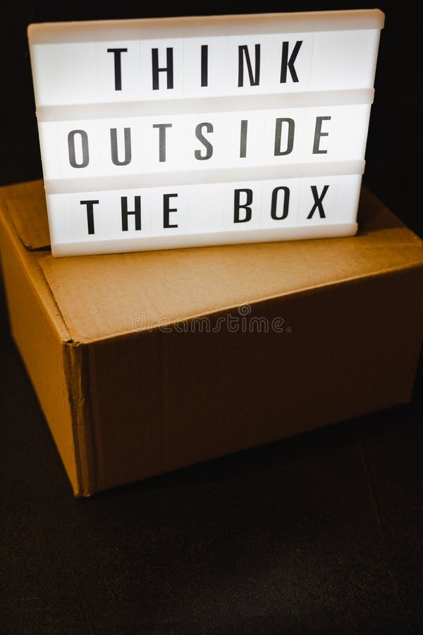 Think Outside the Box Message on Lightbox on Top of Closed Parcel Stock ...