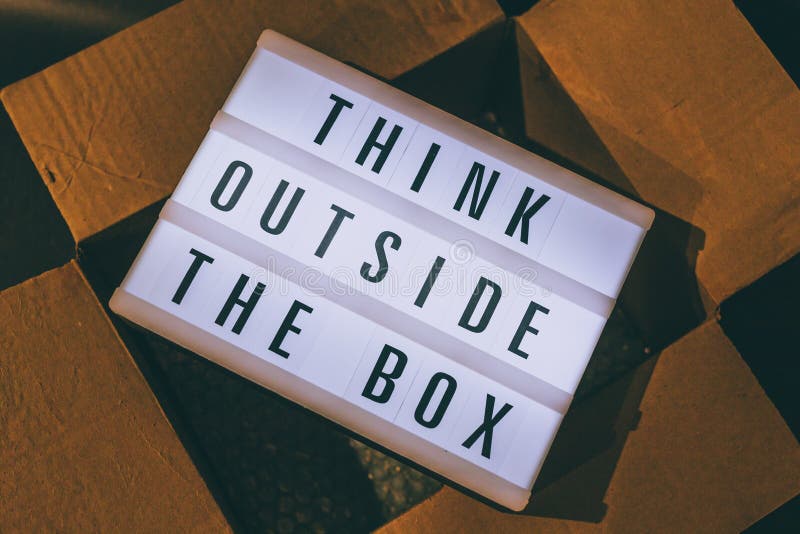 Think Outside the Box Message on Lightbox on Top of Open Parcel Stock ...