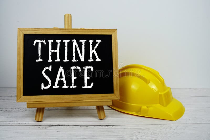 Think Safe Text on Blackboard with Safety Helmet on Wooden Background ...