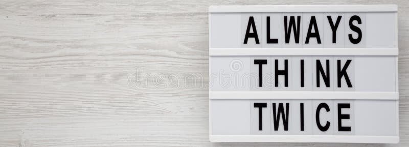 `always Think Twice` Words on a Lightbox on a White Wooden Surface, Top ...