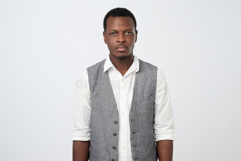 Thinking Afro American Man with Serious Expression Looking into Camera ...