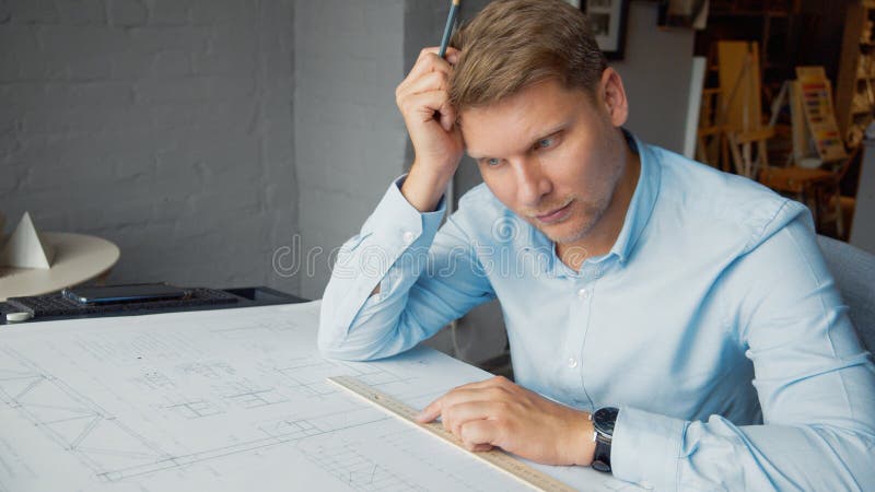 Thinking architect at work stock image. Image of plans - 195168087