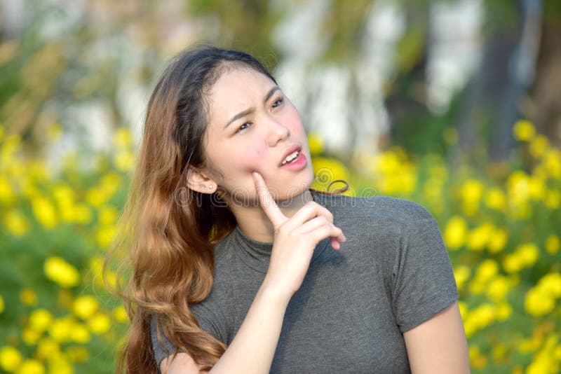 Thinking Beautiful Filipina Female Sitting at Condo Stock Image - Image ...