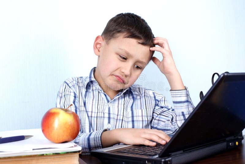 Thinking boy at PC stock photo. Image of education, hate - 13145444