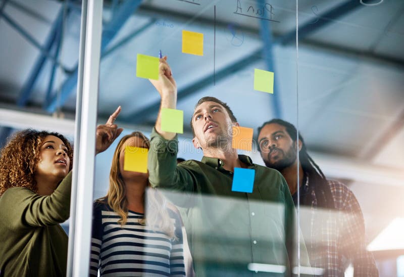 Thinking, Business and People with Notes on Glass Wall for Planning ...