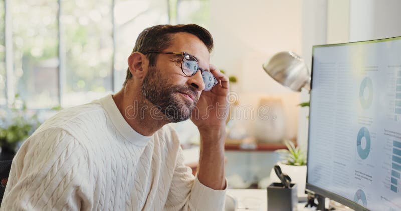 Thinking, Charts and Man on Computer in Home for Review of Graphs for ...