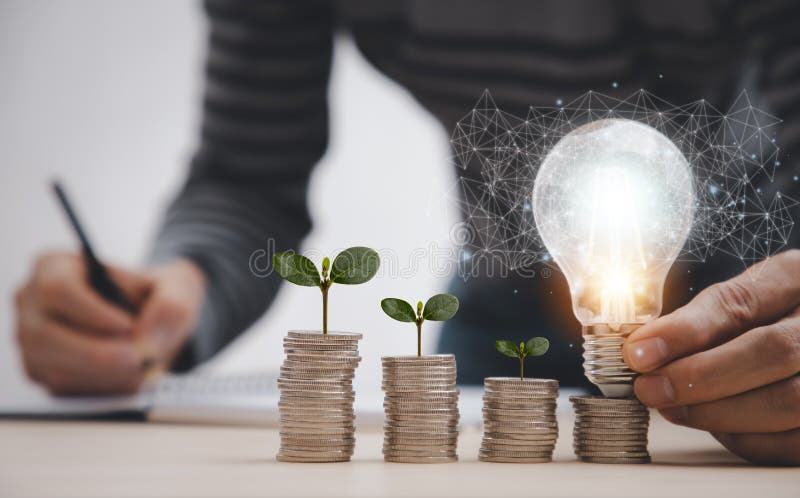 Thinking and Creative with Coins and Light Bulb Concept,Close Up Light ...