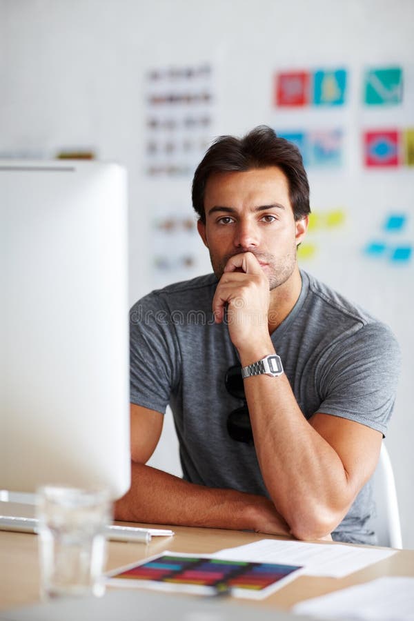 Thinking Creative Thoughts. a Handsome Young Man Sitting in Front of ... Thinking Creative Thoughts. a Handsome Young Man Sitting in Front of ...