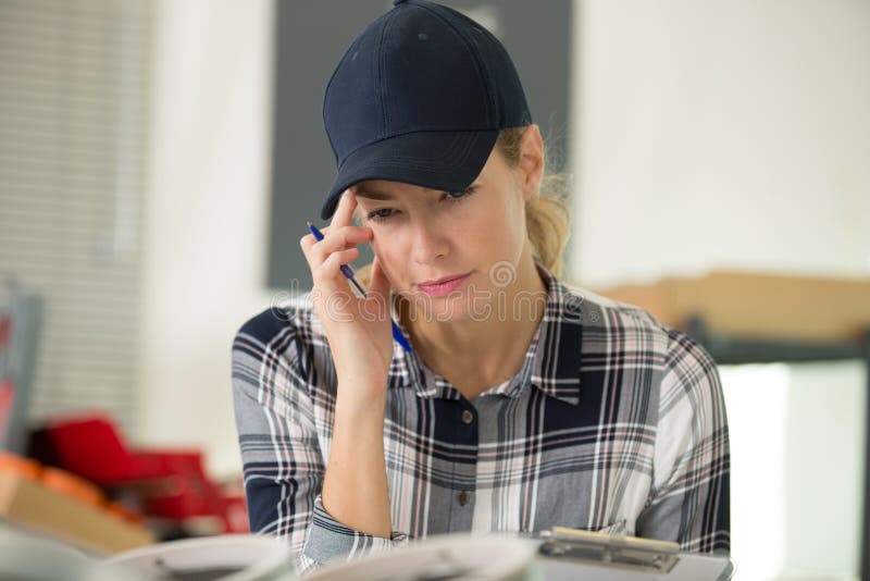 Thinking Female Technician Indoors Stock Image - Image of technology ...