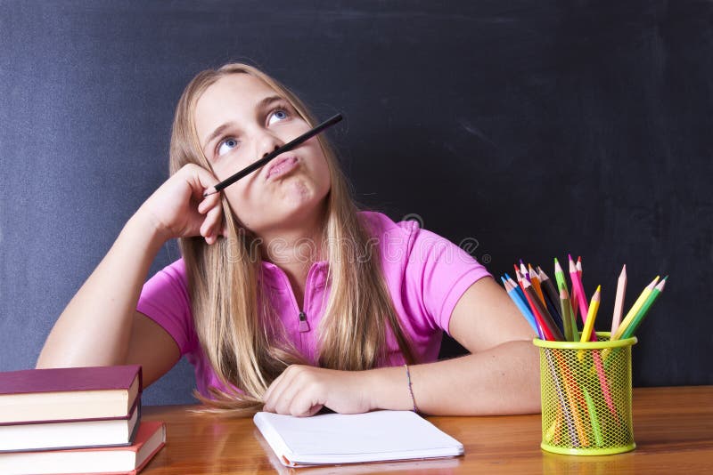 Thinking girl at school stock photo. Image of classroom - 77570166