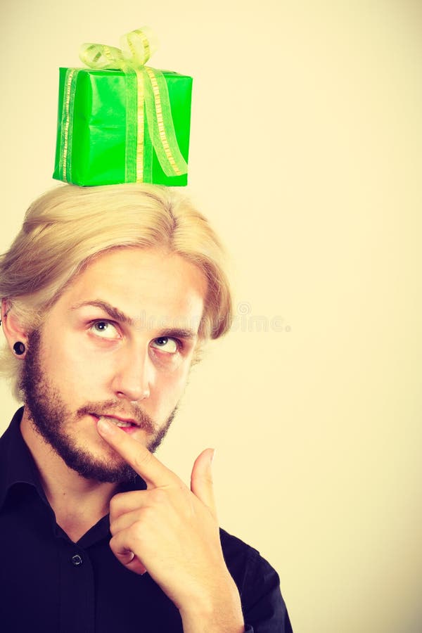 Thinking Guy with Green Gift Box on His Head Stock Photo - Image of ...