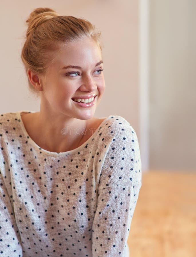 Thinking Happy Thoughts. a Smiling Young Woman at Home. Stock Photo ...