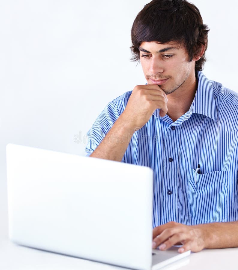 Thinking Hard while Working on His Laptop. a Young Office Working Using ...