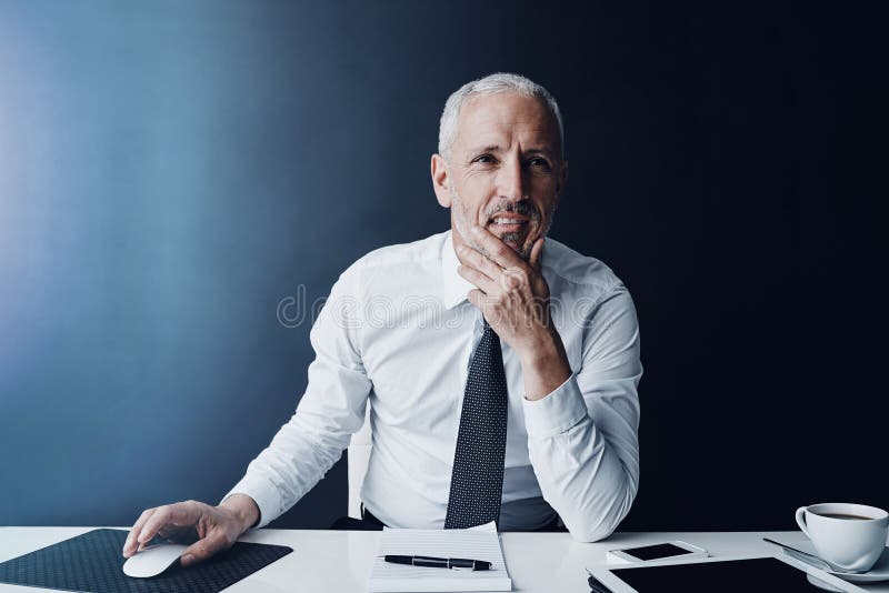 Thinking about How Best To Move Forward. a Mature Businessman Working ...