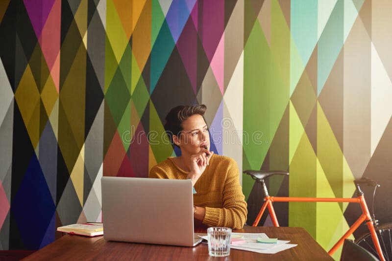 Thinking about Innovative Ideas. a Creative Employee Working in a ...