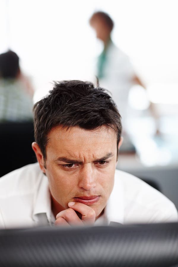 Thinking Long and Hard. a Young Businessman Looking Thoughtful in the ...