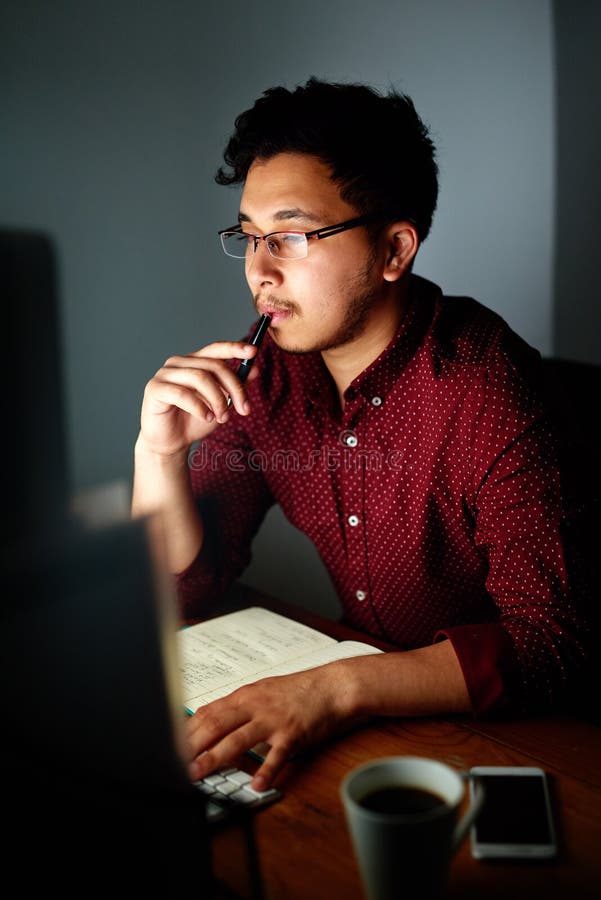 Thinking Man And Computer At Night In Office With Notebook Data