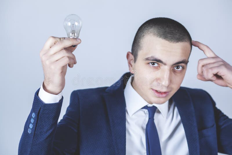 Thinking man hand bulb stock photo. Image of concept - 171804516