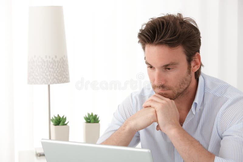 Thinking man with laptop stock photo. Image of concentration - 20750896