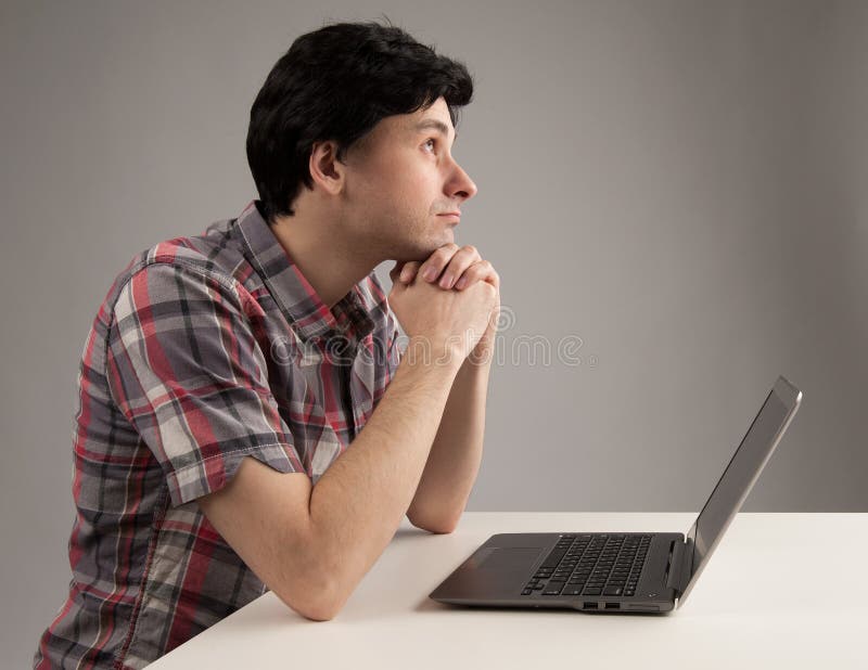 Thinking man with laptop stock photo. Image of computer - 47502864