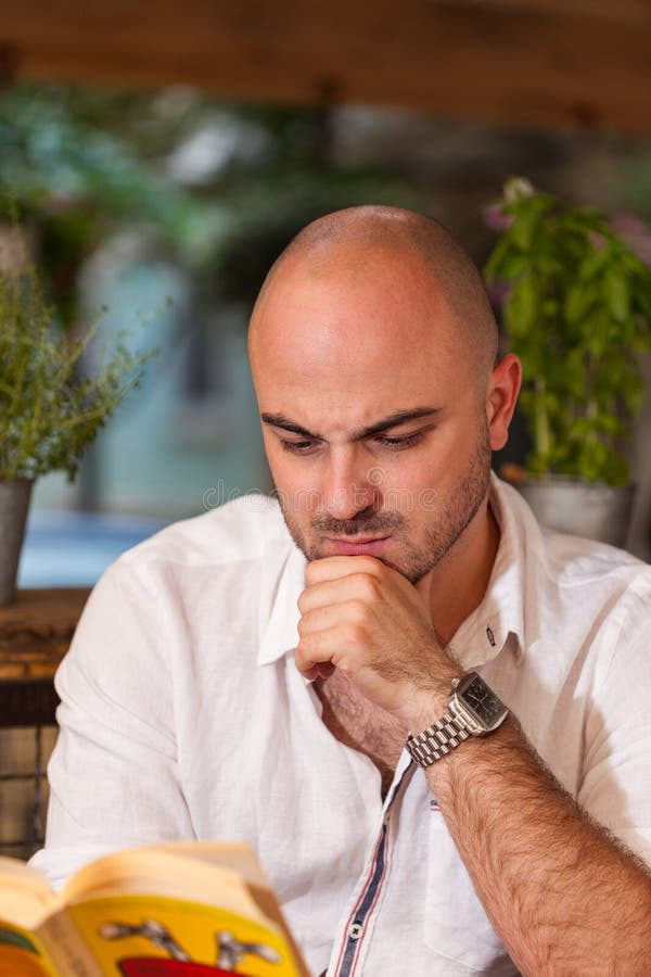 Thinking Man Reading a Book Stock Image - Image of beard, clothing ...