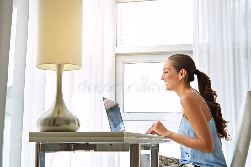 Thinking about the Perfect Response. a Young Woman Using a Laptop at ...