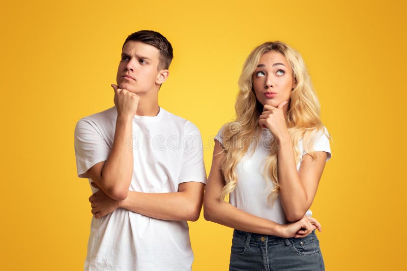 Portrait of Thoughtful Young Couple on Yellow Background Stock Image ...