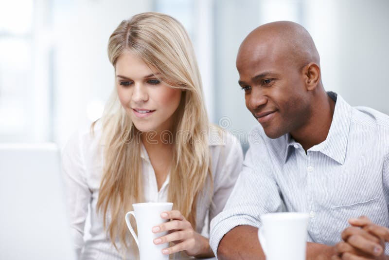 Thinking of Some Solutions. Two Young Businesspeople Working Together ...