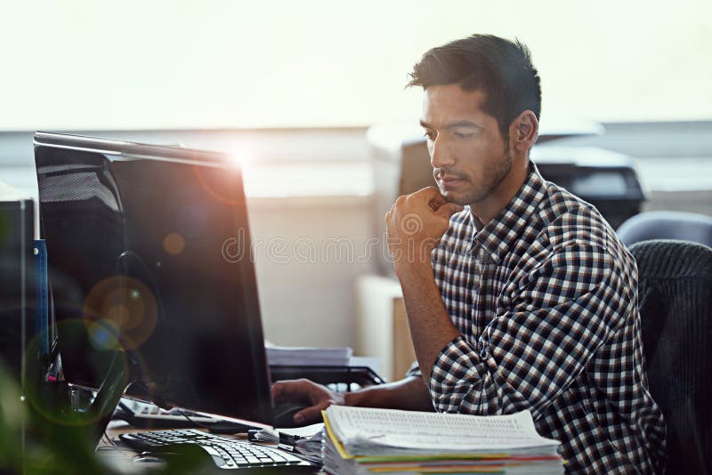 Thinking Things through. Cropped Shot of a Businessman Working at His ...