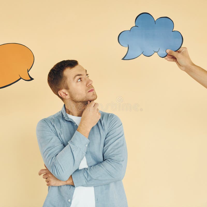 Thinking about Two Ideas. Man Standing in the Studio with Empty Signs ...