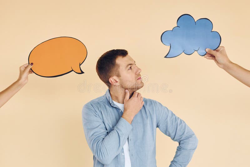 Thinking about Two Ideas. Man Standing in the Studio with Empty Signs ...
