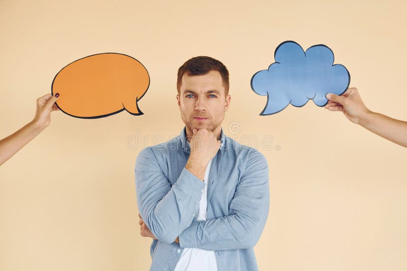 Thinking about Two Ideas. Man Standing in the Studio with Empty Signs ...