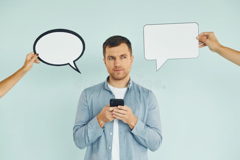 Thinking What To Answer. Man Standing in the Studio with Empty Signs ...