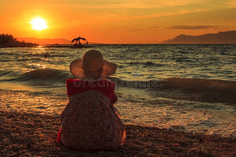Thinking Woman Sit in the Sunset on the Beach Stock Photo - Image of ...